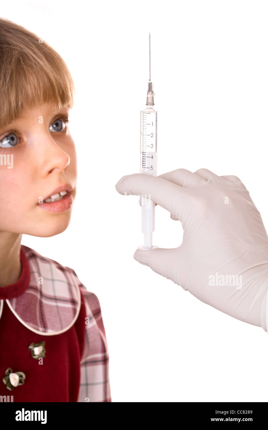 Child look on syringe in doctor hand Stock Photo - Alamy