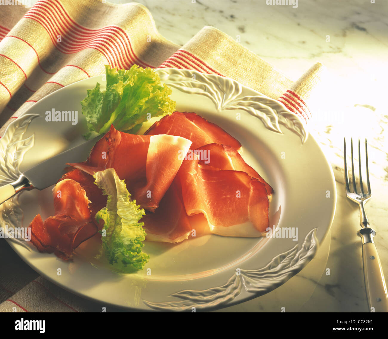 Still: Slices of smoked ham on plate Stock Photo - Alamy
