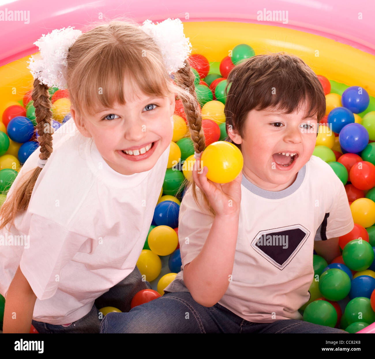Children and ball group on playground Stock Photo - Alamy