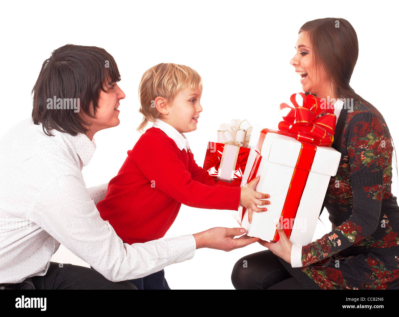 Happy family with white gift box. Isolated Stock Photo - Alamy