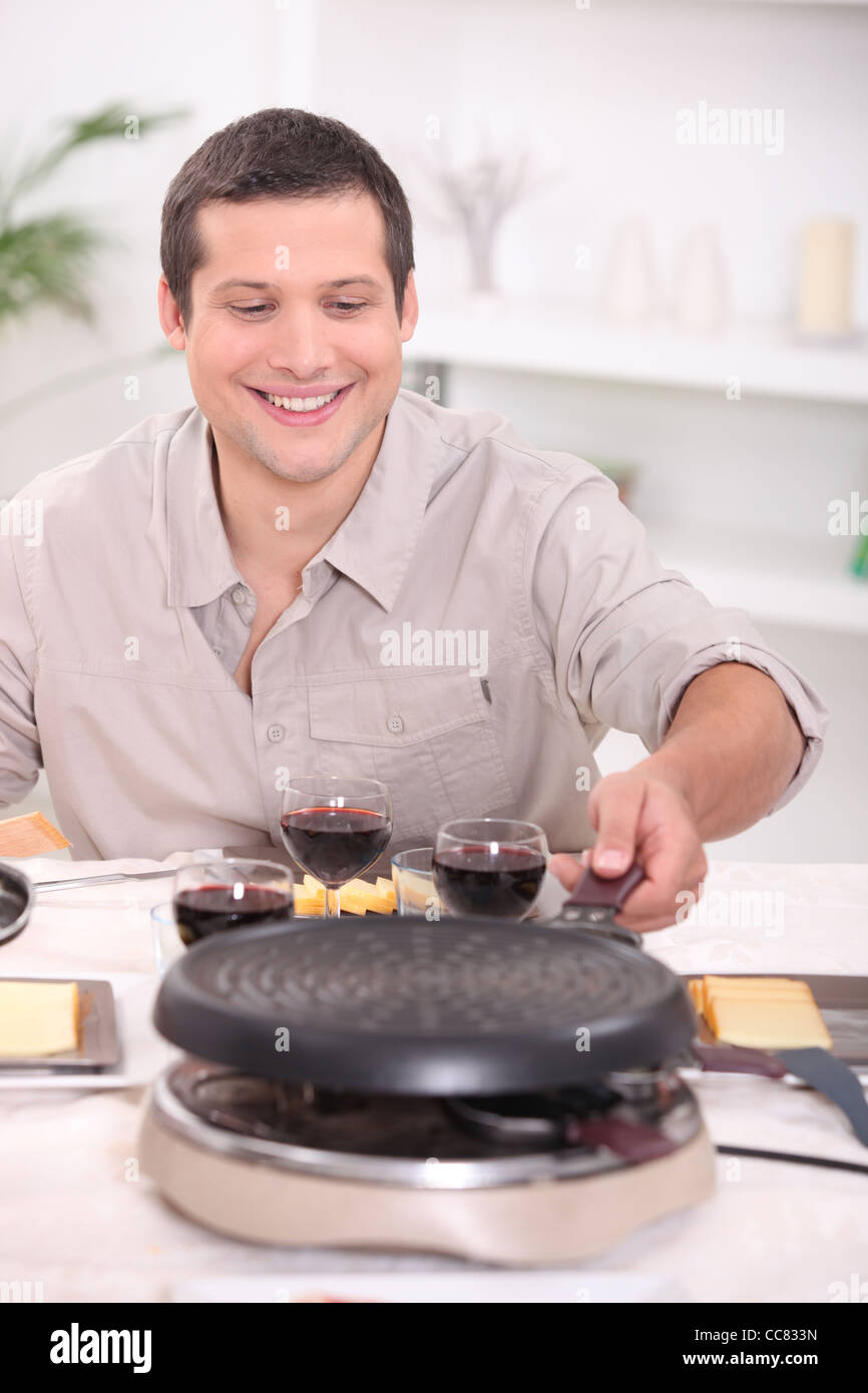 Man eating raclette hi-res stock photography and images - Alamy