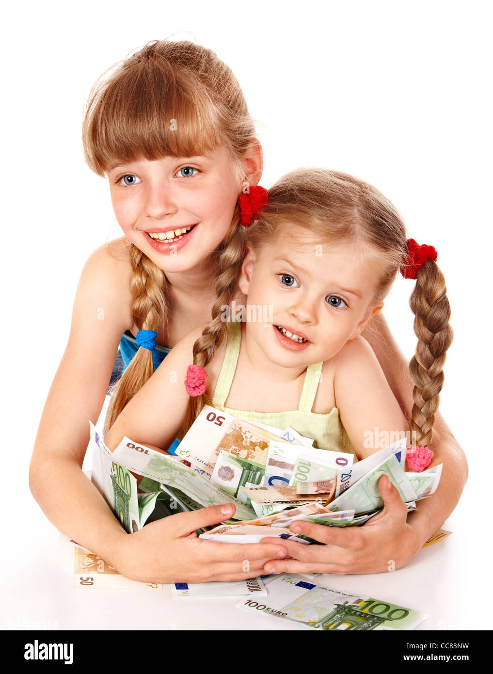 Children holding pile of money Stock Photo - Alamy