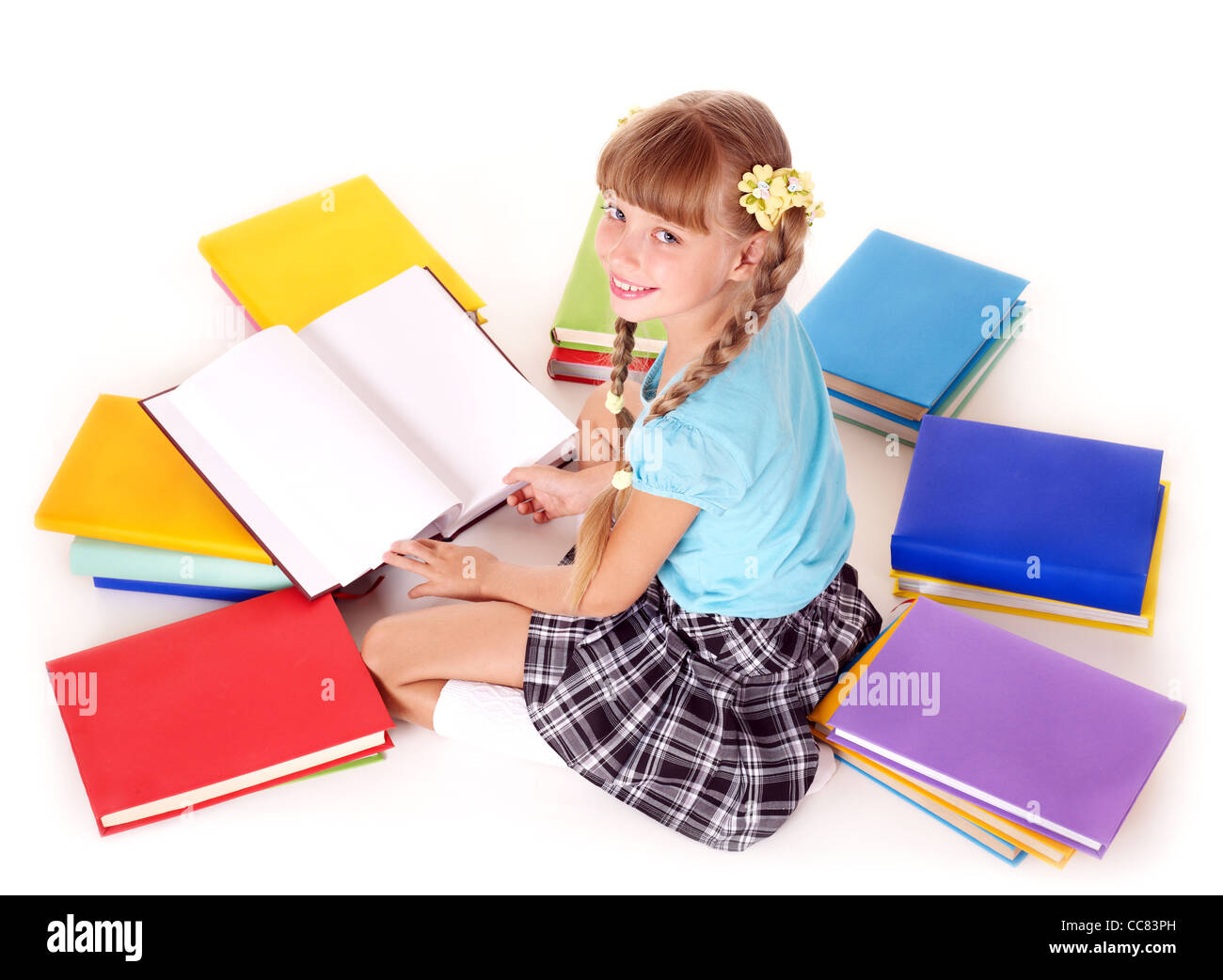 Child with pile of books reading on floor Stock Photo - Alamy