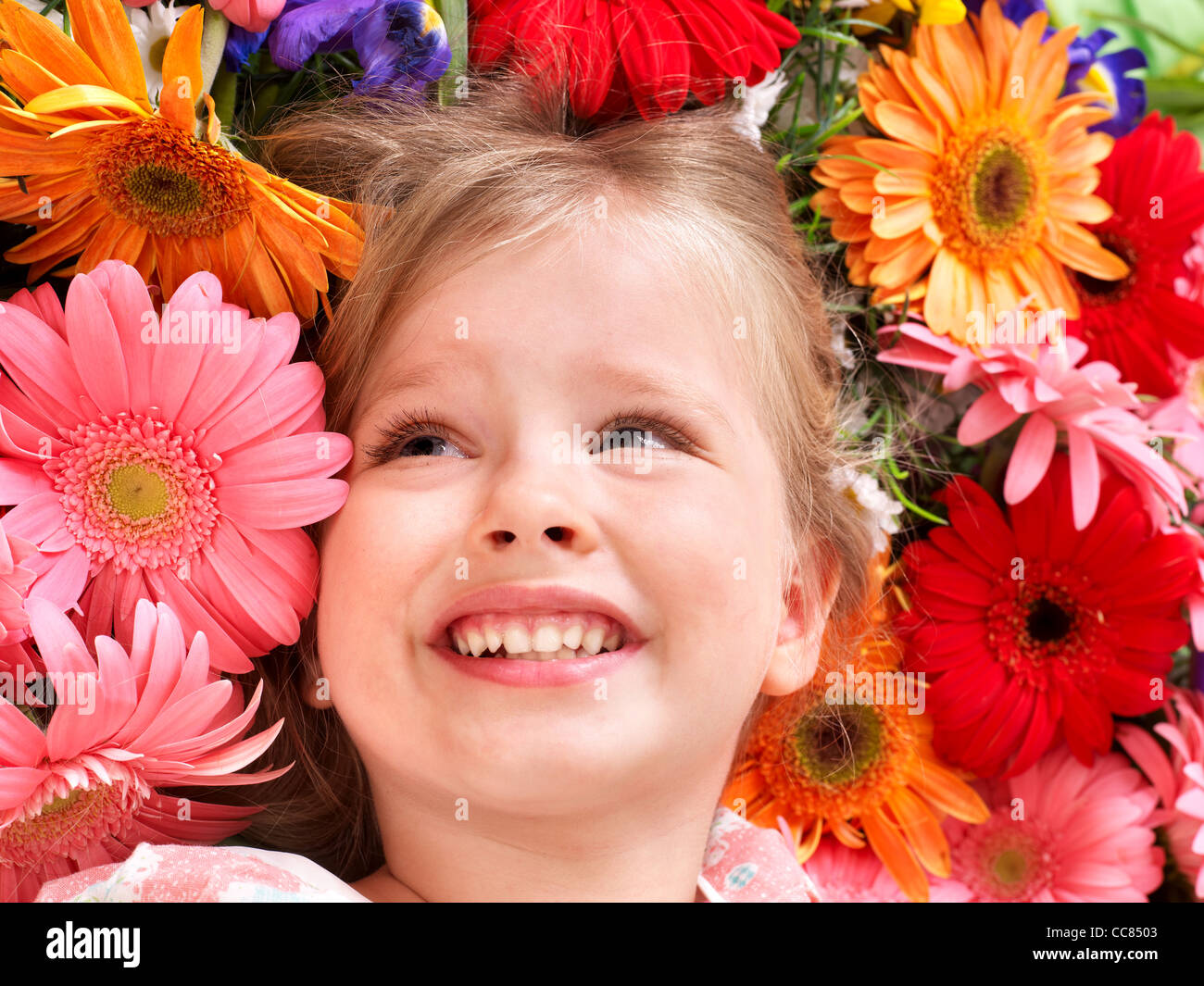 Child lying on the flower Stock Photo - Alamy
