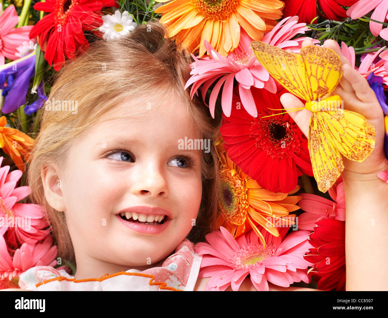 Child lying on the flower Stock Photo - Alamy