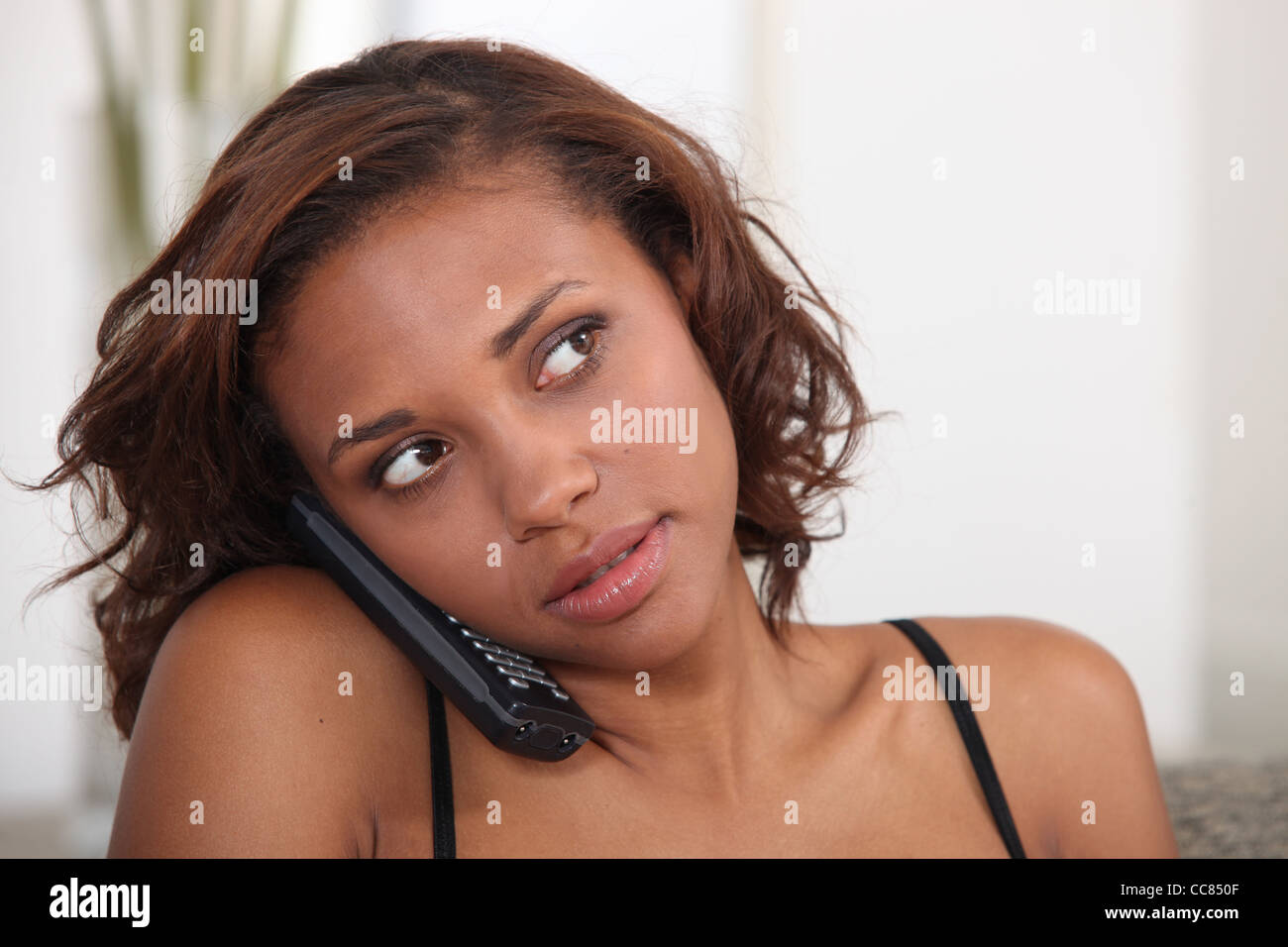 Child phone call talking worried hi-res stock photography and images ...