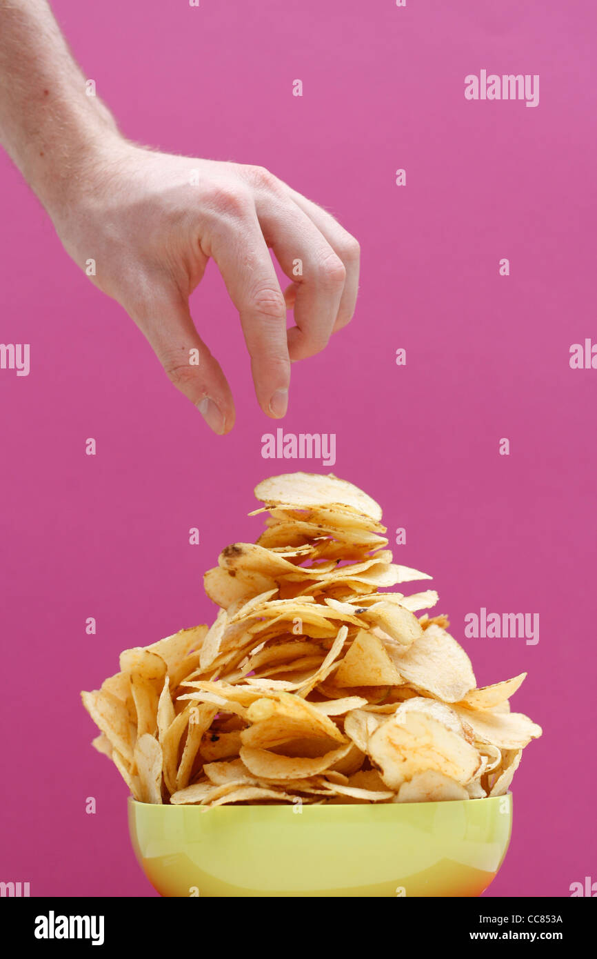 Eating potato chips Stock Photo - Alamy