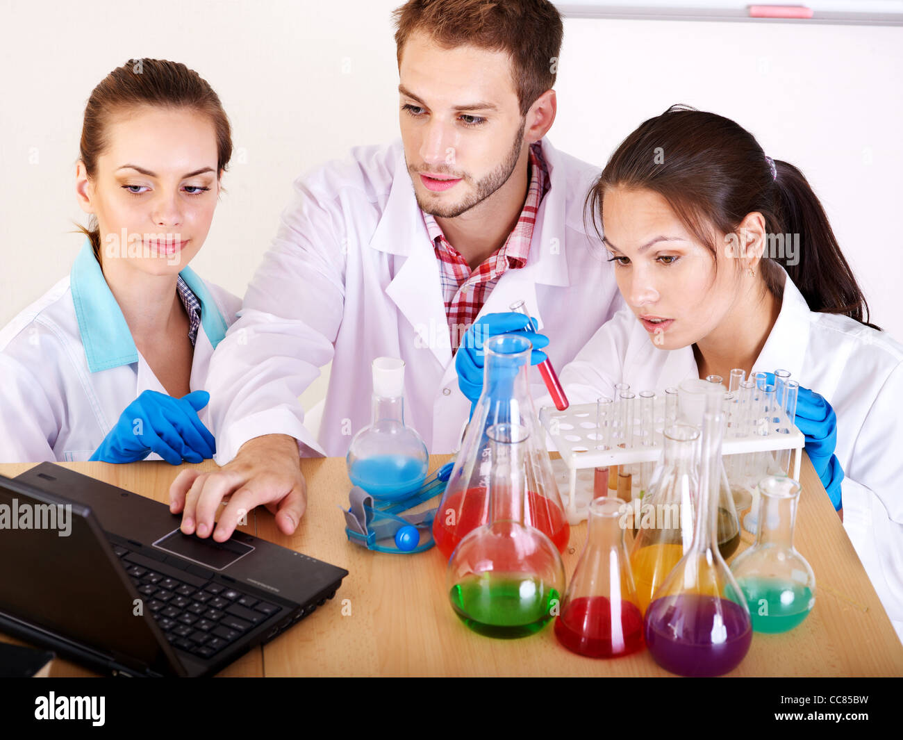 Group chemistry student with flask in classroom Stock Photo - Alamy