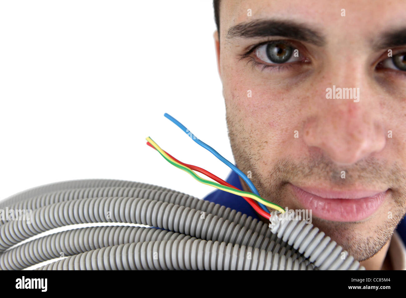 Electrician with conduit Stock Photo - Alamy