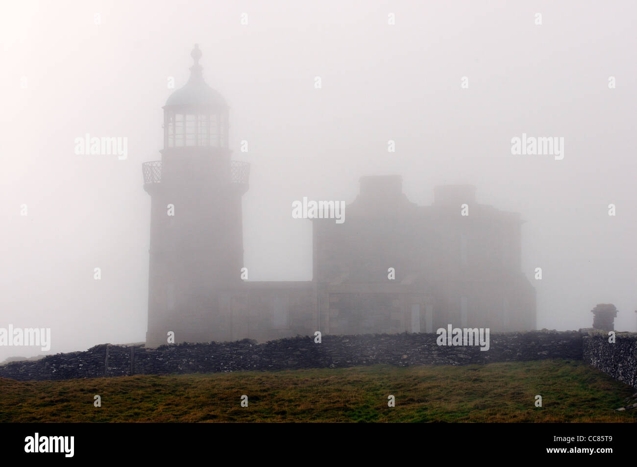 Calf of Man Lower Lighthouse in the fog, The Isle of Man Stock Photo ...