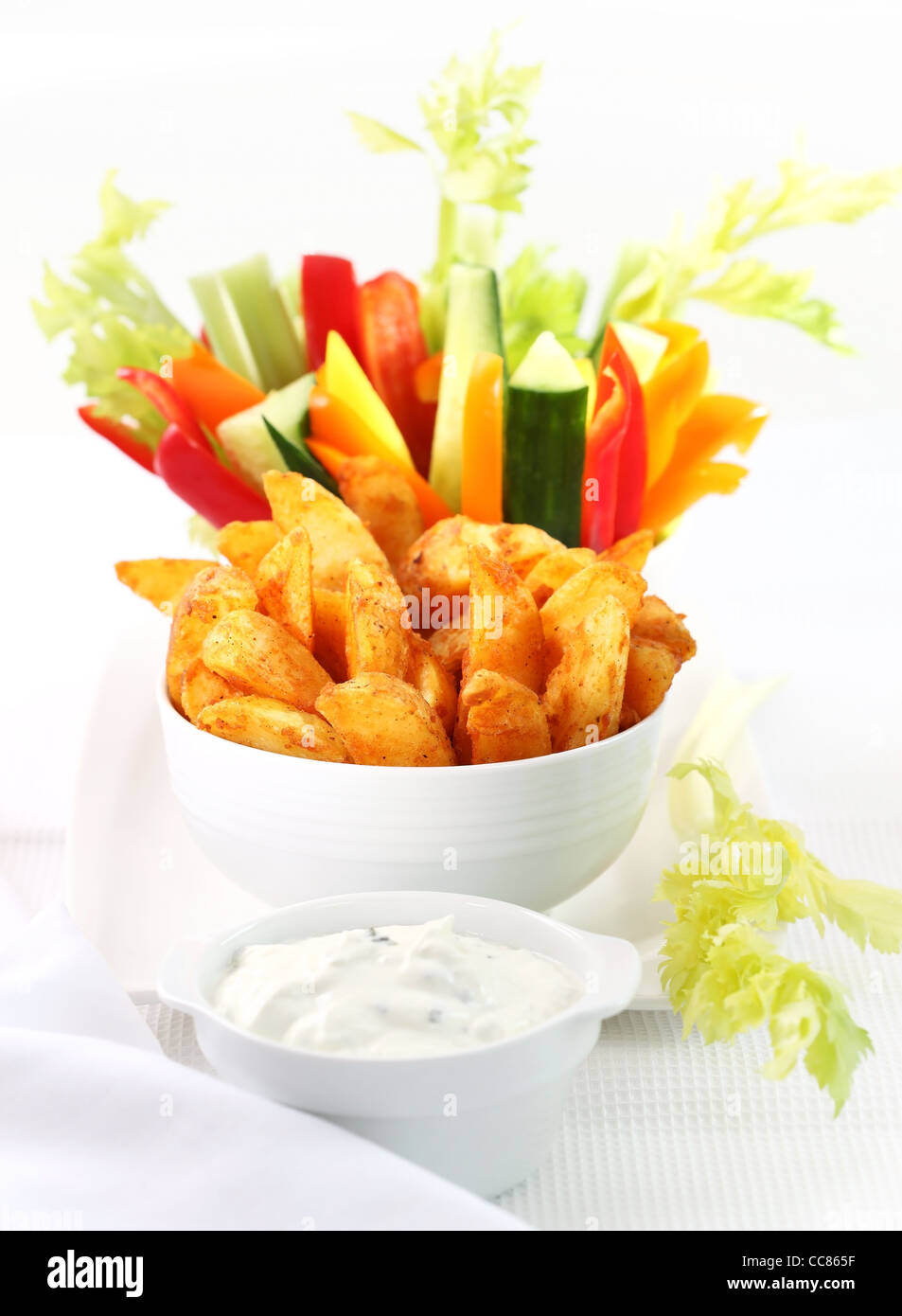 Raw vegetable and wedges with cream cheese dip Stock Photo - Alamy