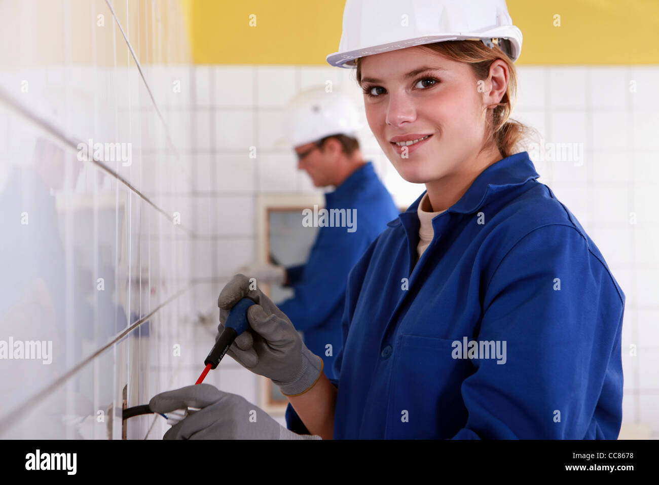 Two electrician working as team Stock Photo - Alamy