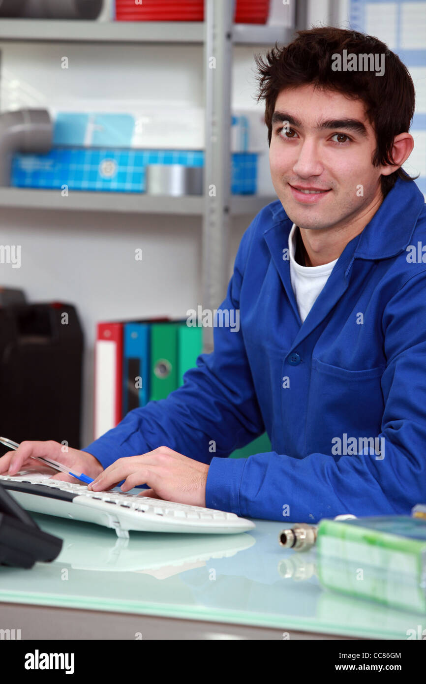 Young apprentice doing paperwork Stock Photo - Alamy
