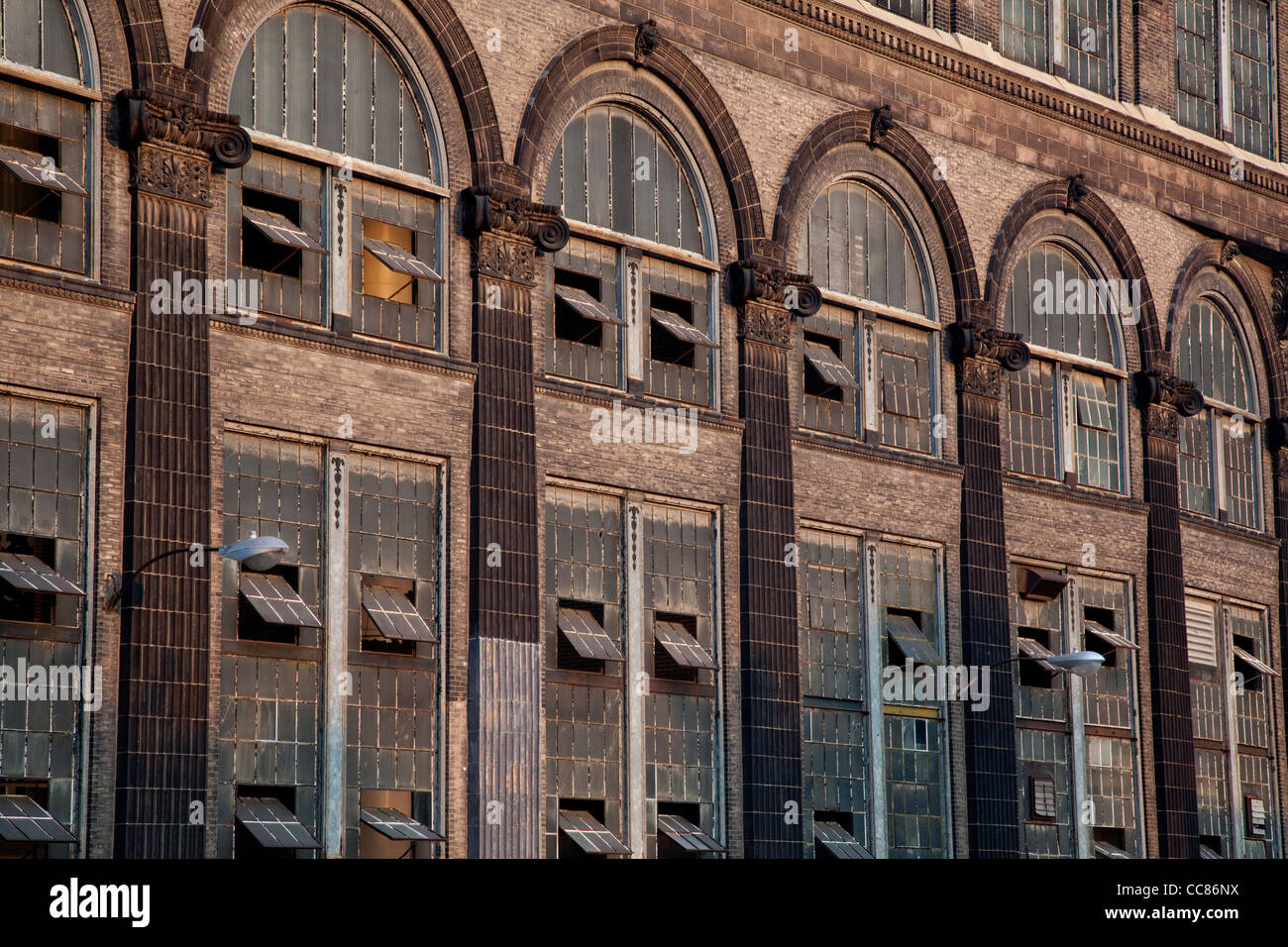 old power plant - windows and brick walls with sandstone decoration ...