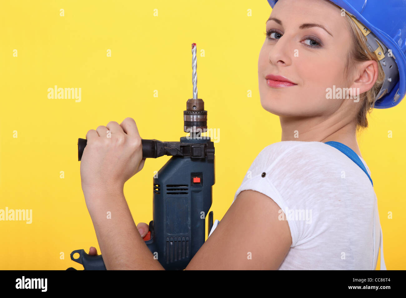 female worker with electric drill Stock Photo - Alamy