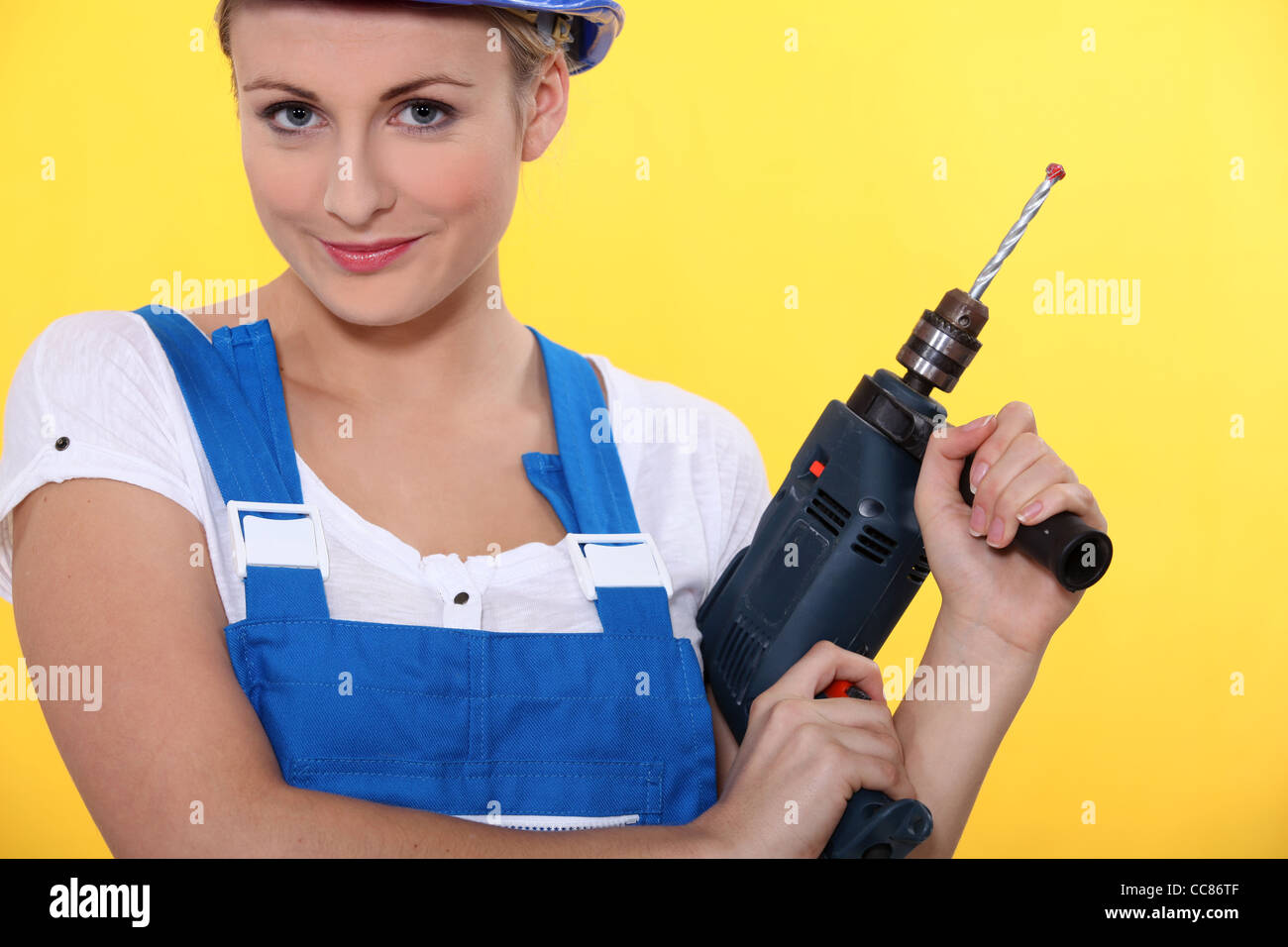 portrait of a woman with drill Stock Photo - Alamy