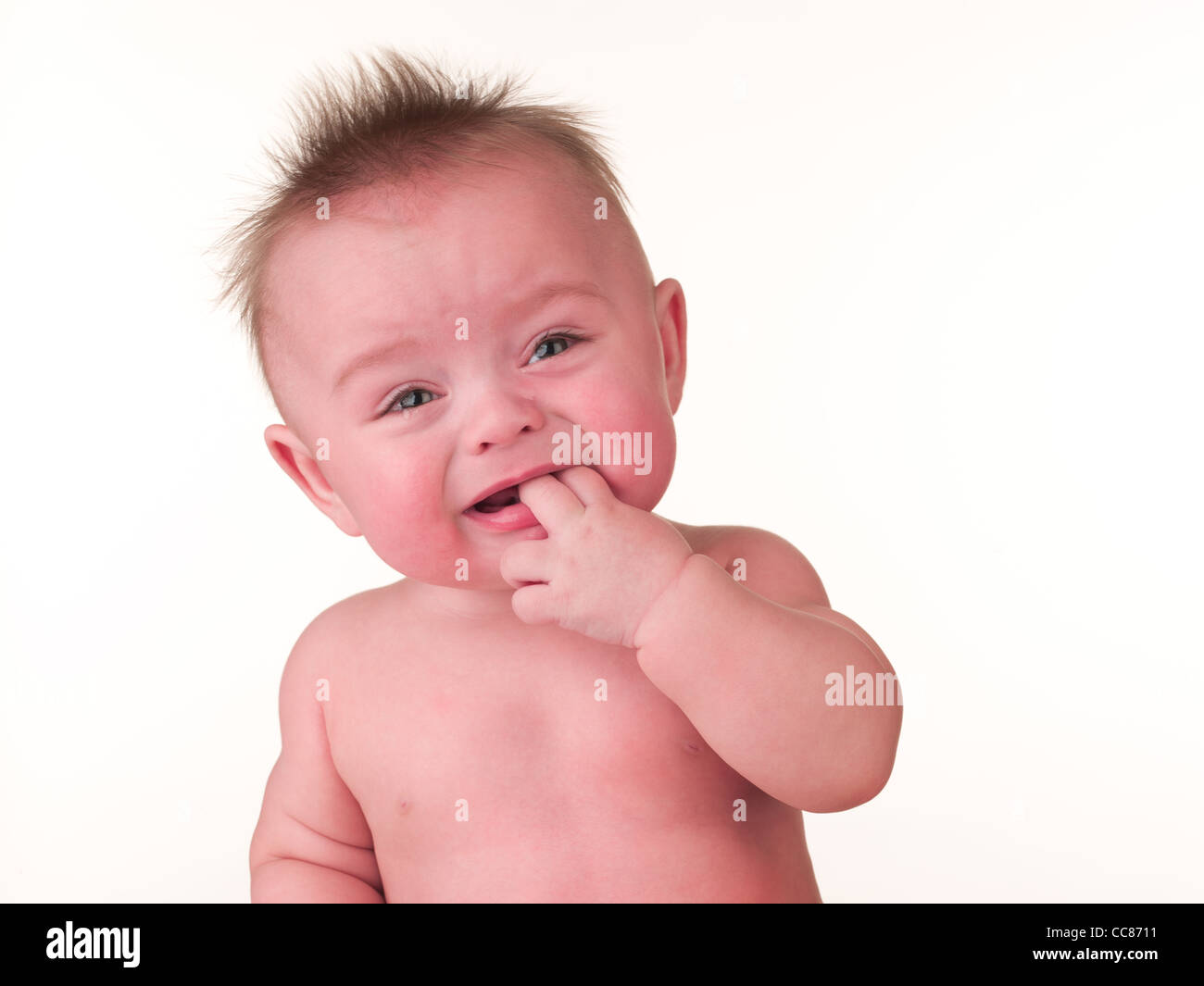 upset baby boy on a white background Stock Photo - Alamy