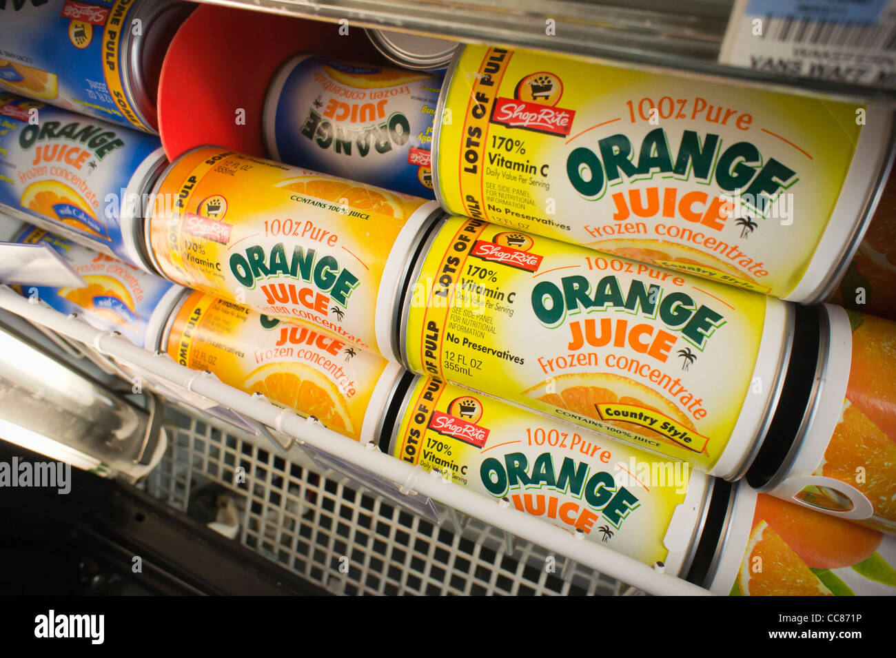 Cans of store brand frozen orange juice are seen in a supermarket ...