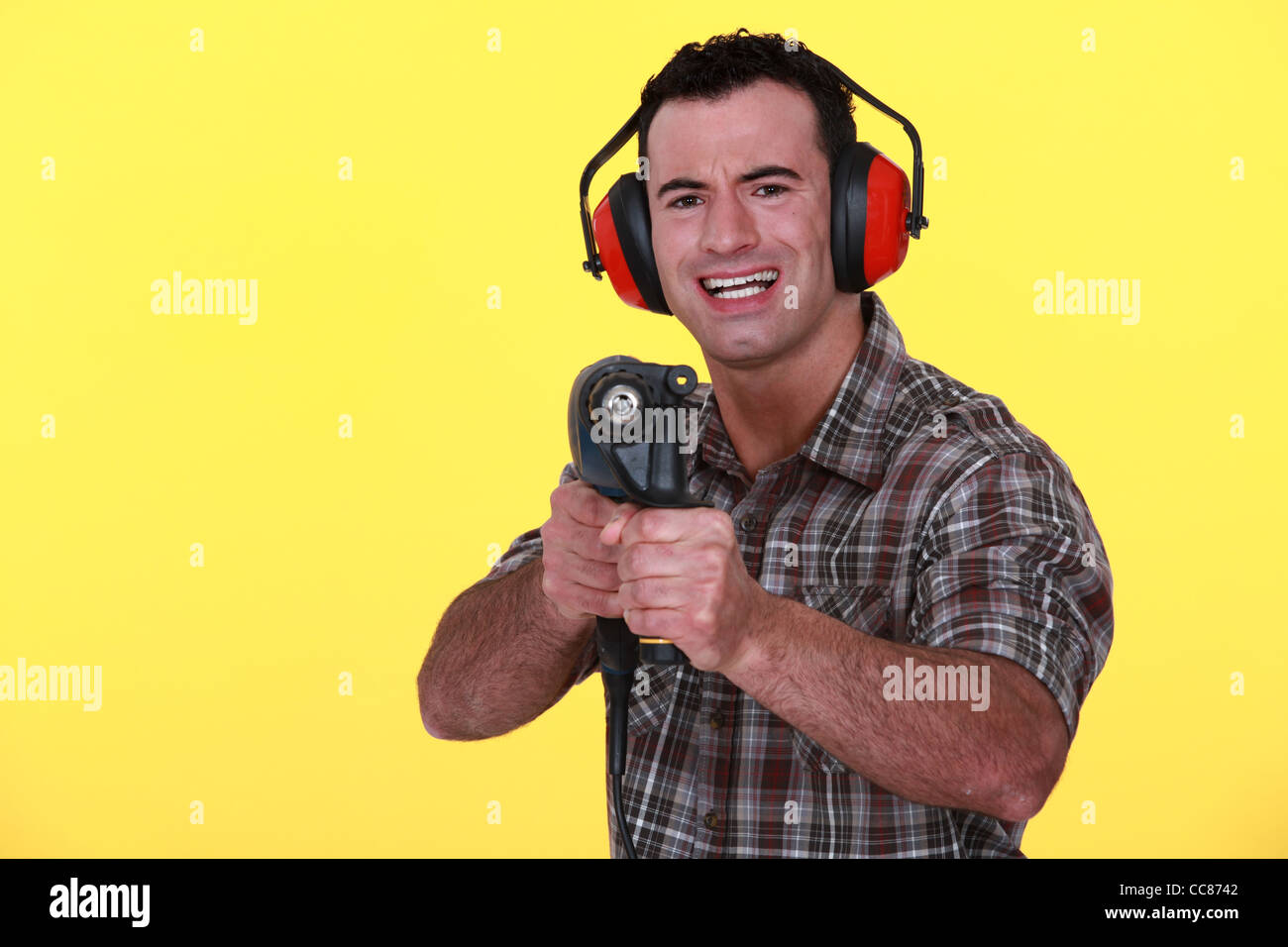 Man with a powerdrill Stock Photo - Alamy