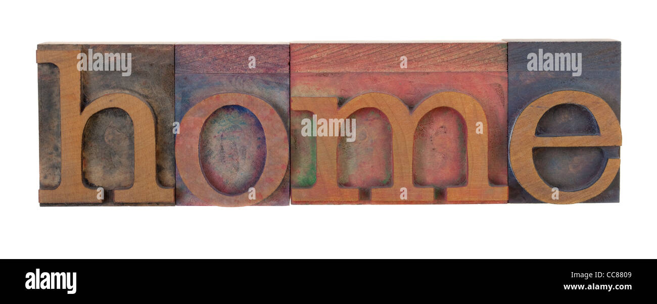 home - word in vintage letterpress printing blocks, stained by color ...