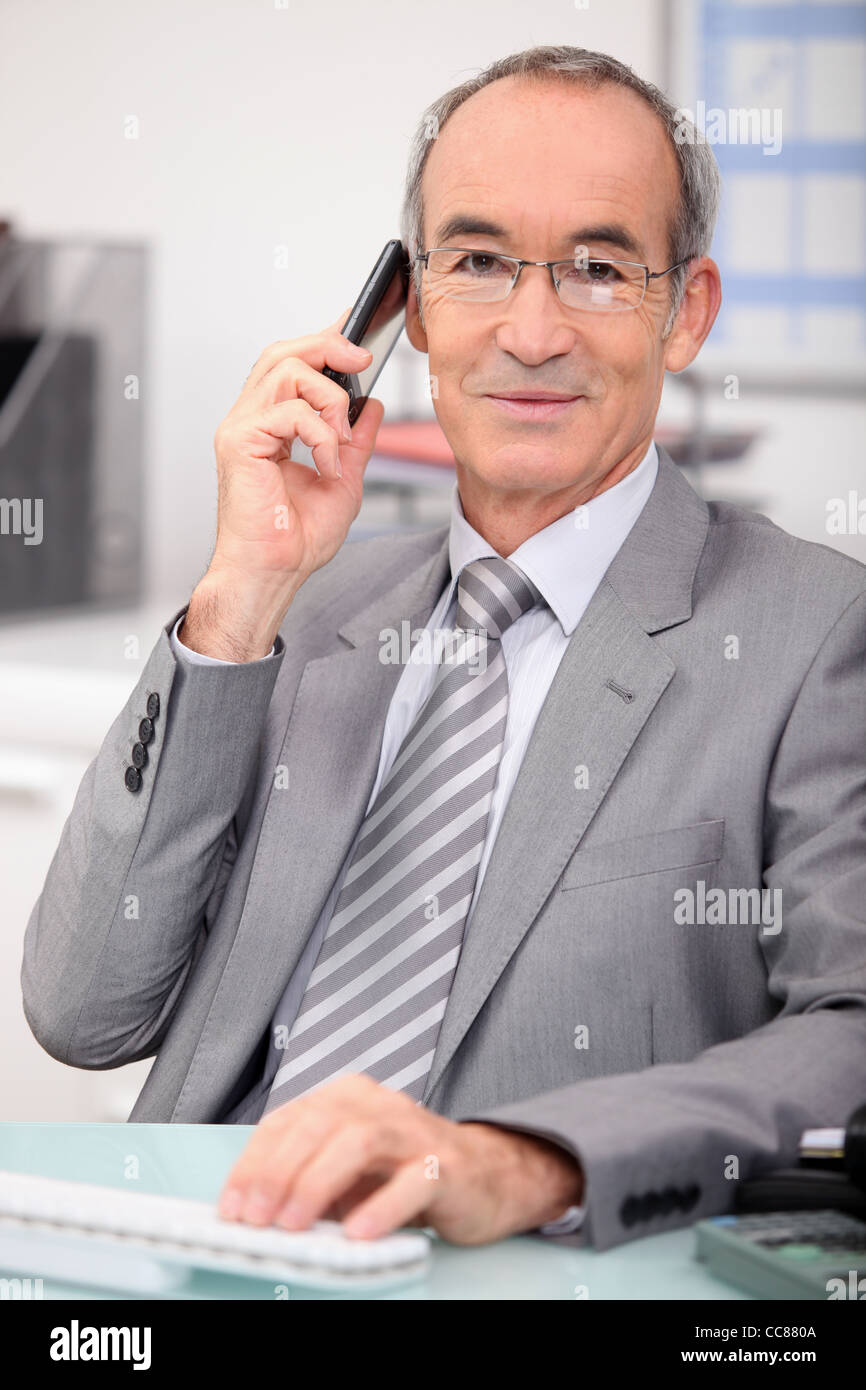 Senior executive on the phone Stock Photo - Alamy