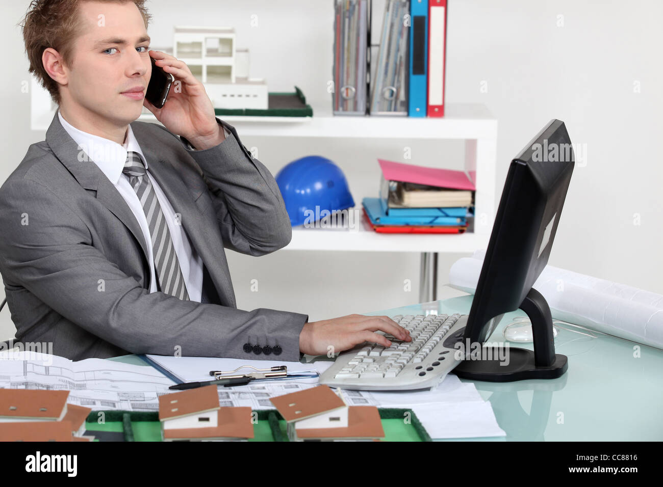 Architect sat in office Stock Photo - Alamy
