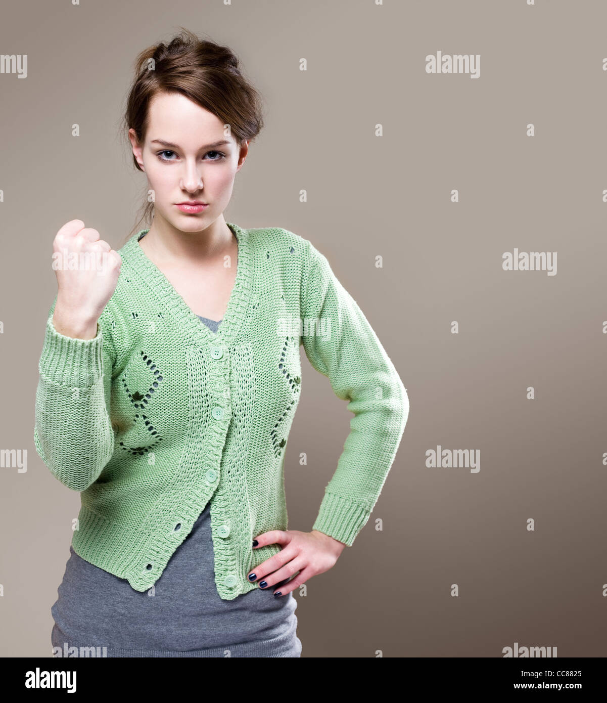 Portrait of beautiful young brunette with very aggressive stance Stock ...