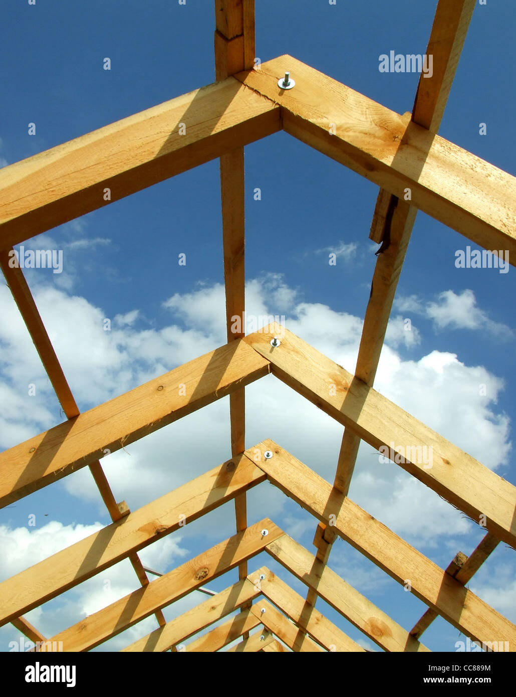 Roof under construction with blue sky and clouds Stock Photo - Alamy