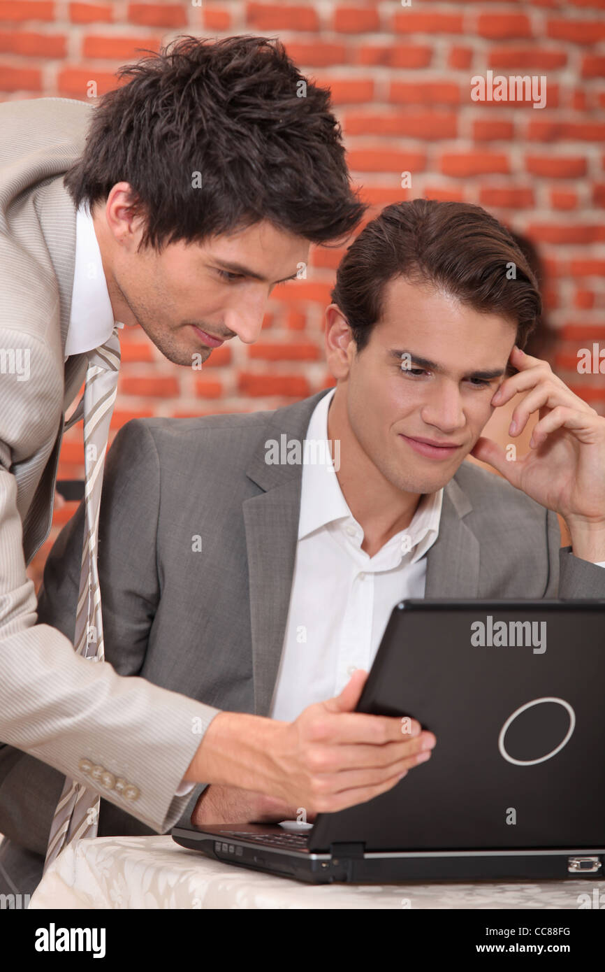 Men connecting to network Stock Photo - Alamy