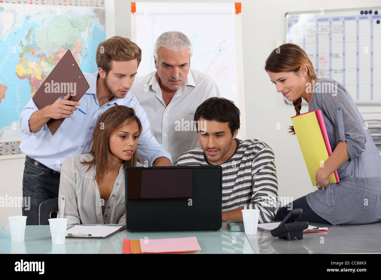 People gathered around map hi-res stock photography and images - Alamy