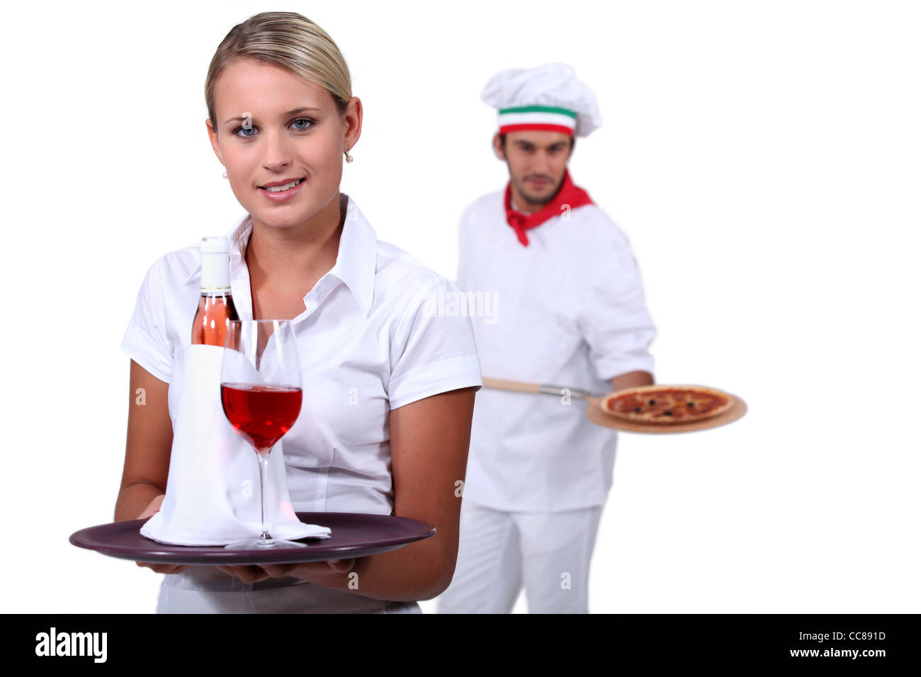Young people working in a restaurant Stock Photo - Alamy