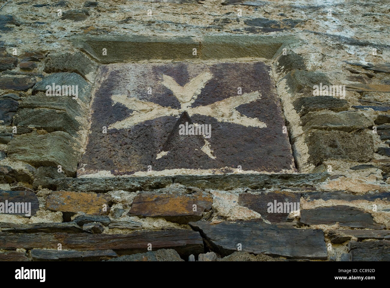 The cross of Malta at the entrance of the Castle of Torrenovaes ...