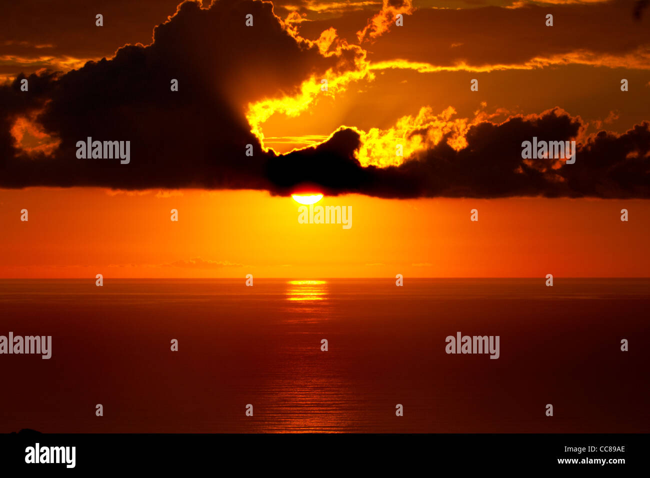 Bright orange tropical sunset hi-res stock photography and images - Alamy
