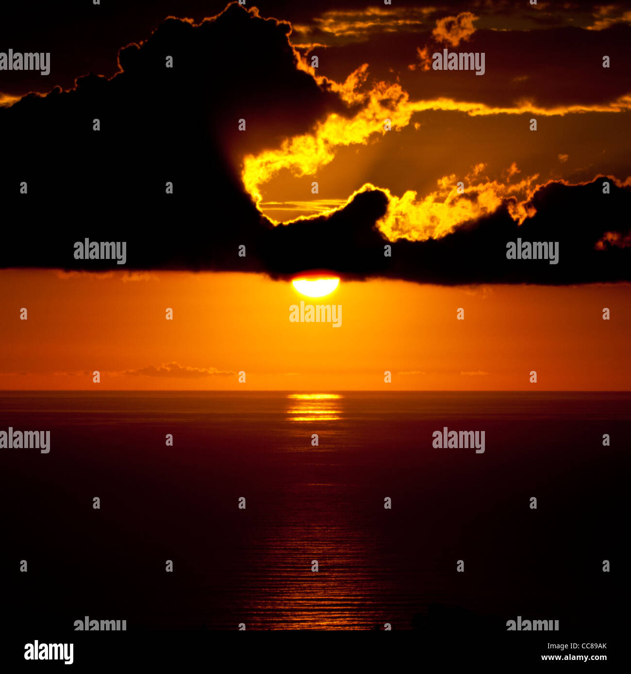 Bright orange tropical sunset hi-res stock photography and images - Alamy