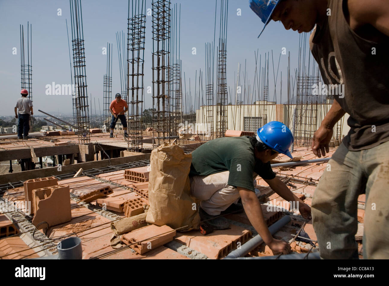 A work crew constructs a new high rise building in Lima, Peru, South ...