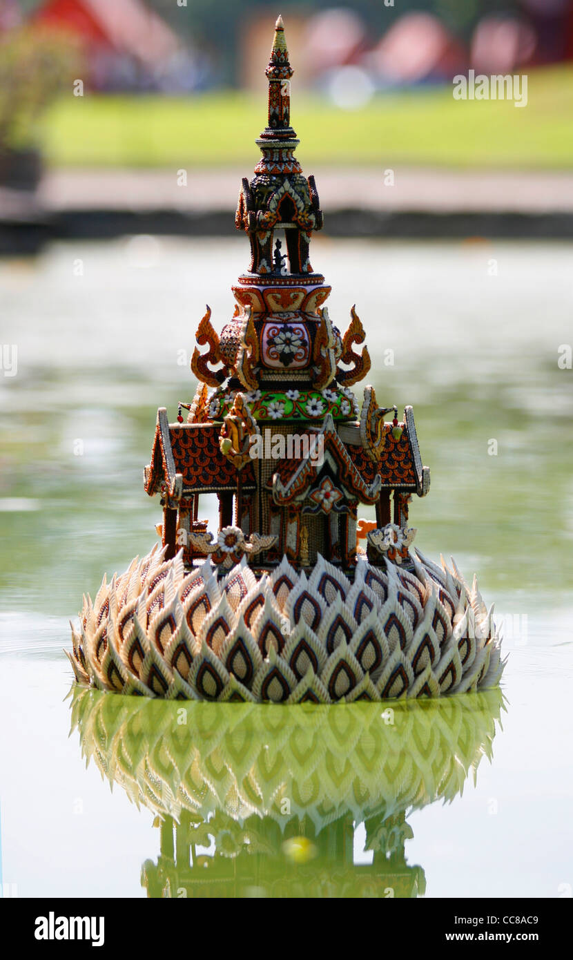 A "krathong" floating ion the water of a pond inside the Sukhothai ...