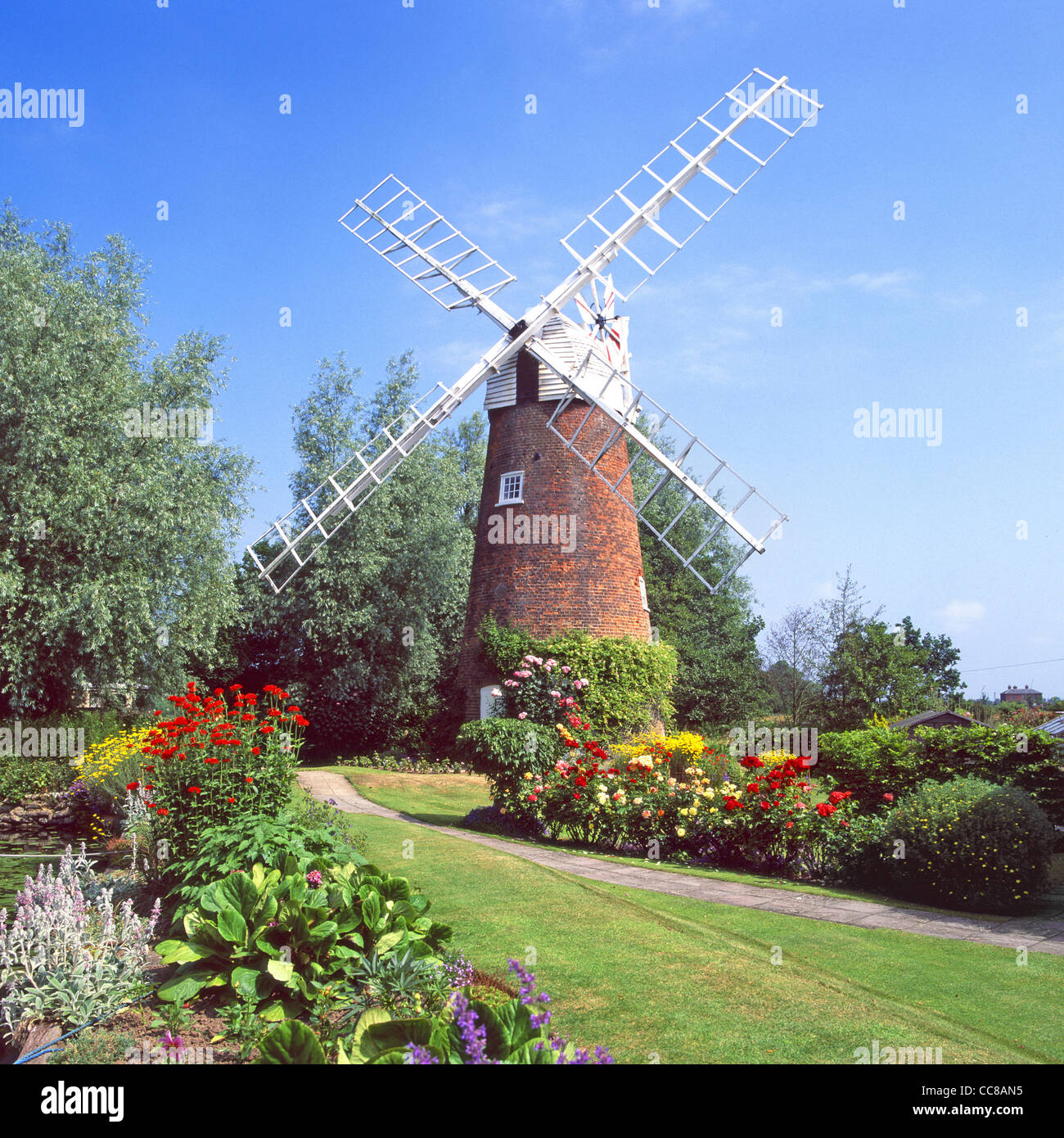 Hunsett Drainage Mill red brick windmill listed building & flower Stock ...