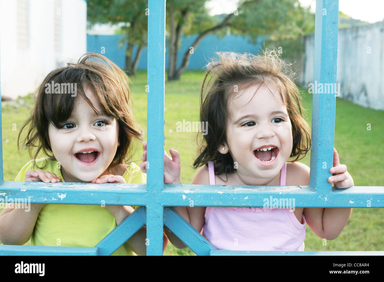 Portrait of happy two sisters outdoors having fun Stock Photo - Alamy