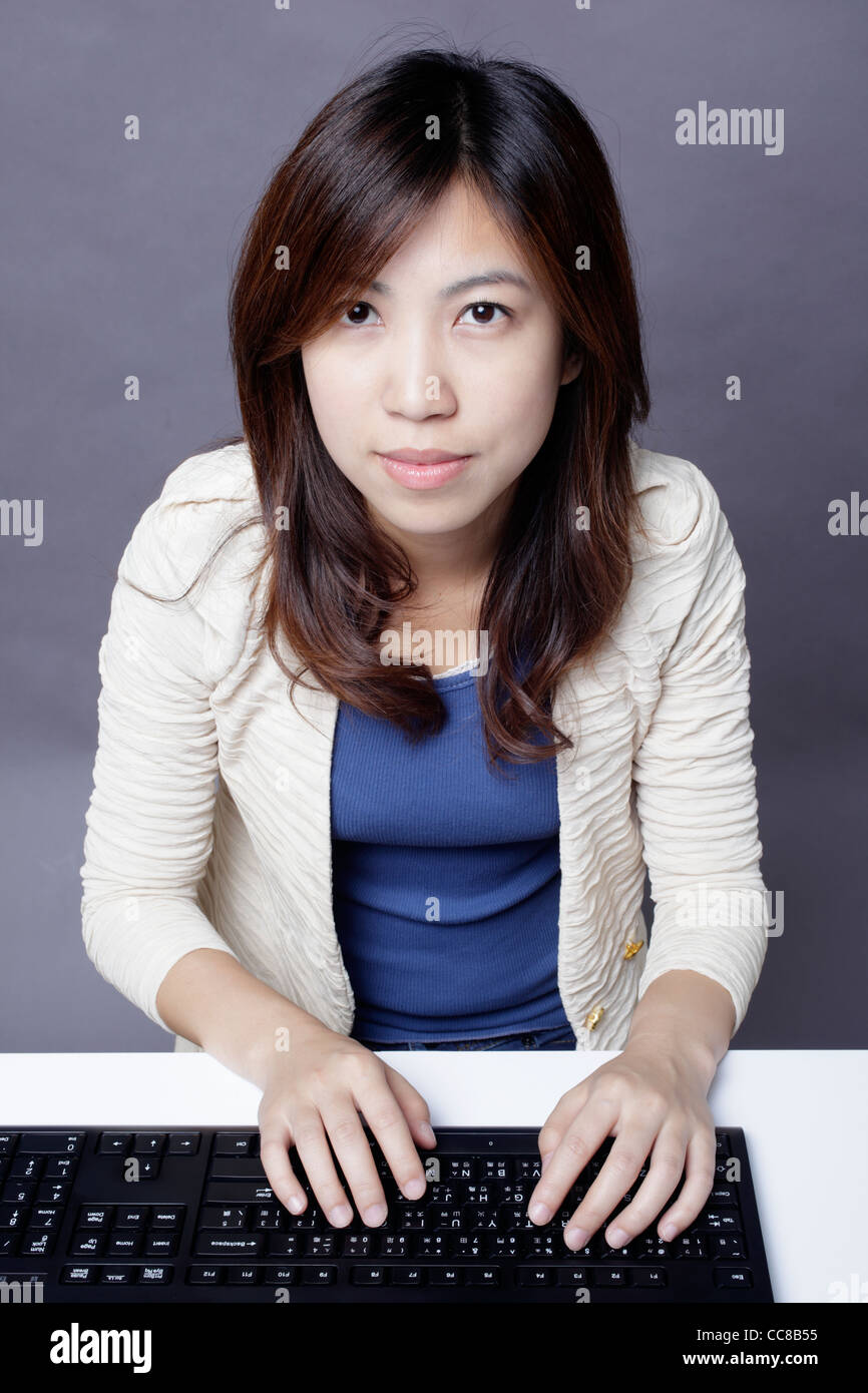 Office lady uses notebook computer Stock Photo - Alamy