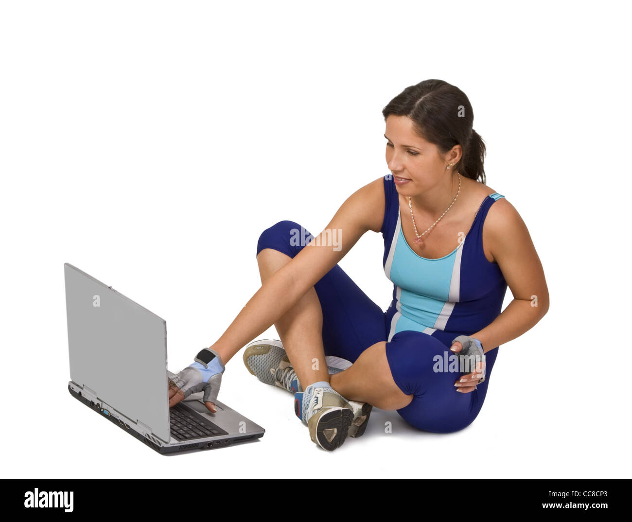 Woman in training equipment searching for something on a laptop Stock ...