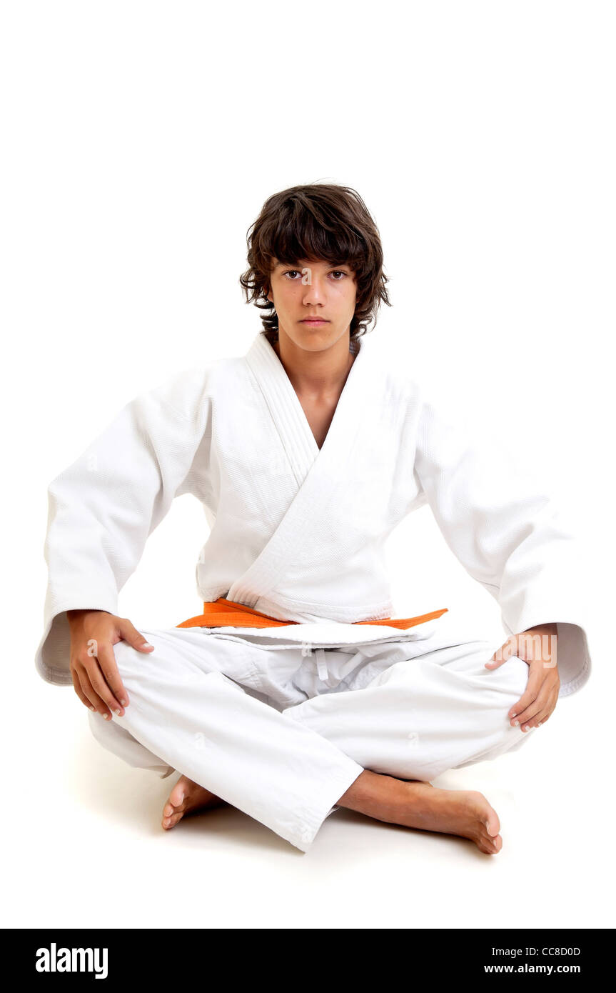 Young fighter posing against a white background Stock Photo - Alamy