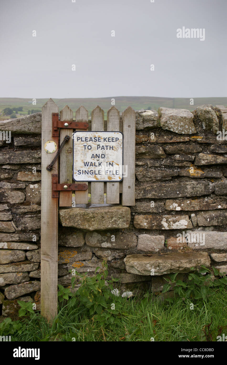 A ladder stile and gate sign on the Pennine Way near Middleton-in ...