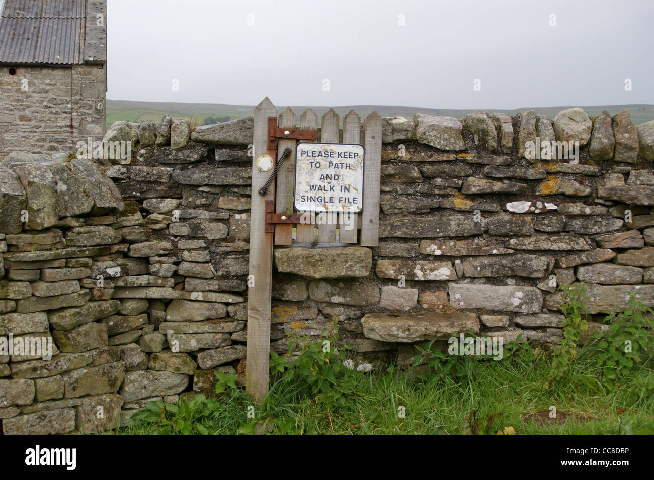 A ladder stile and gate sign on the Pennine Way near Middleton-in ...