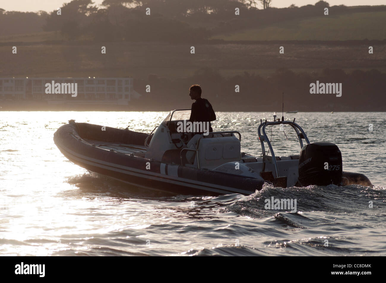 Large RIB turning into the sun Stock Photo - Alamy