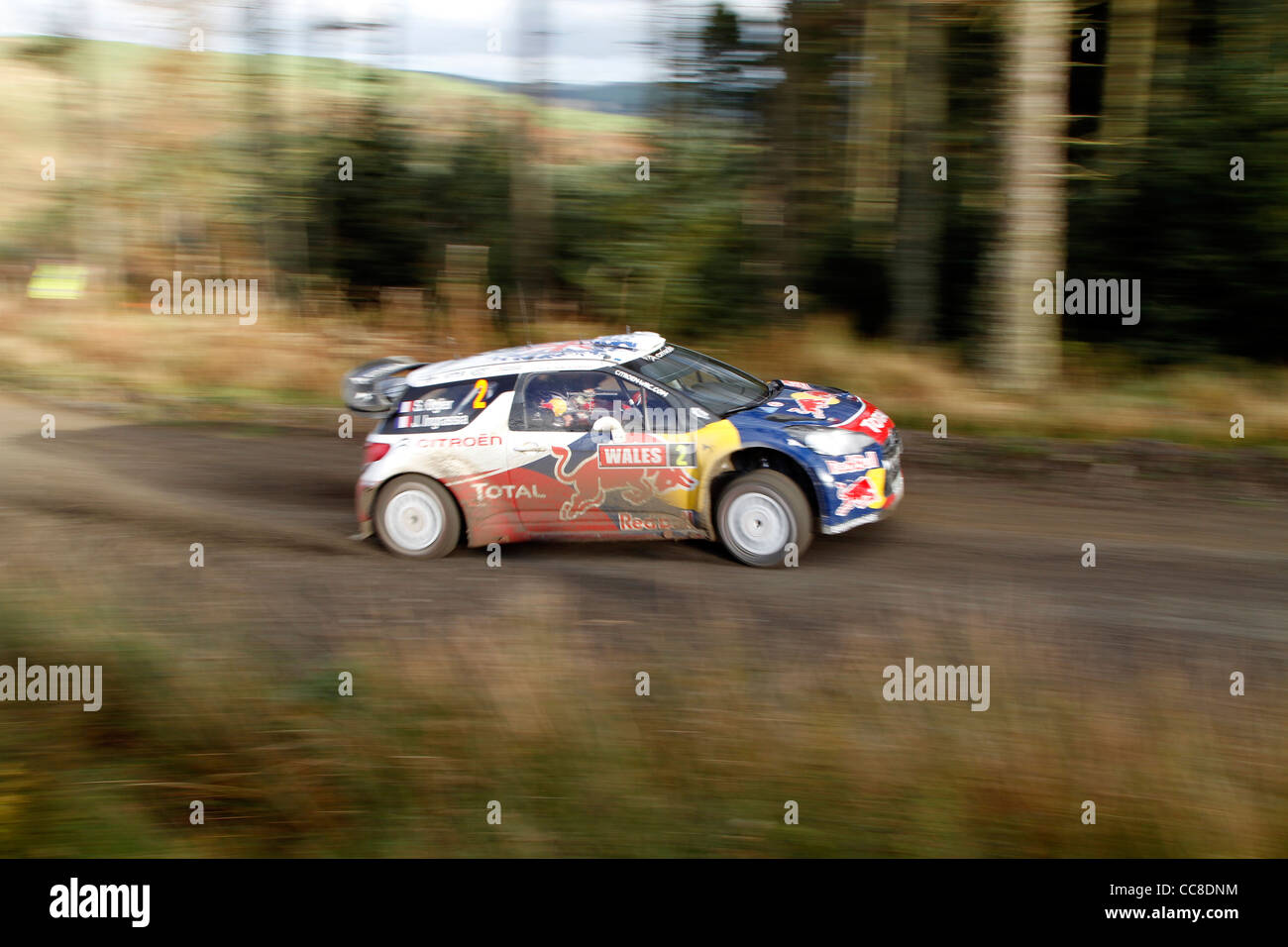 a rally car speeds past Stock Photo - Alamy