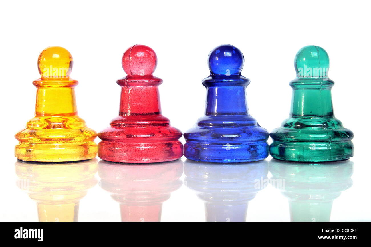Multicolored ludo glass figures over white background Stock Photo - Alamy