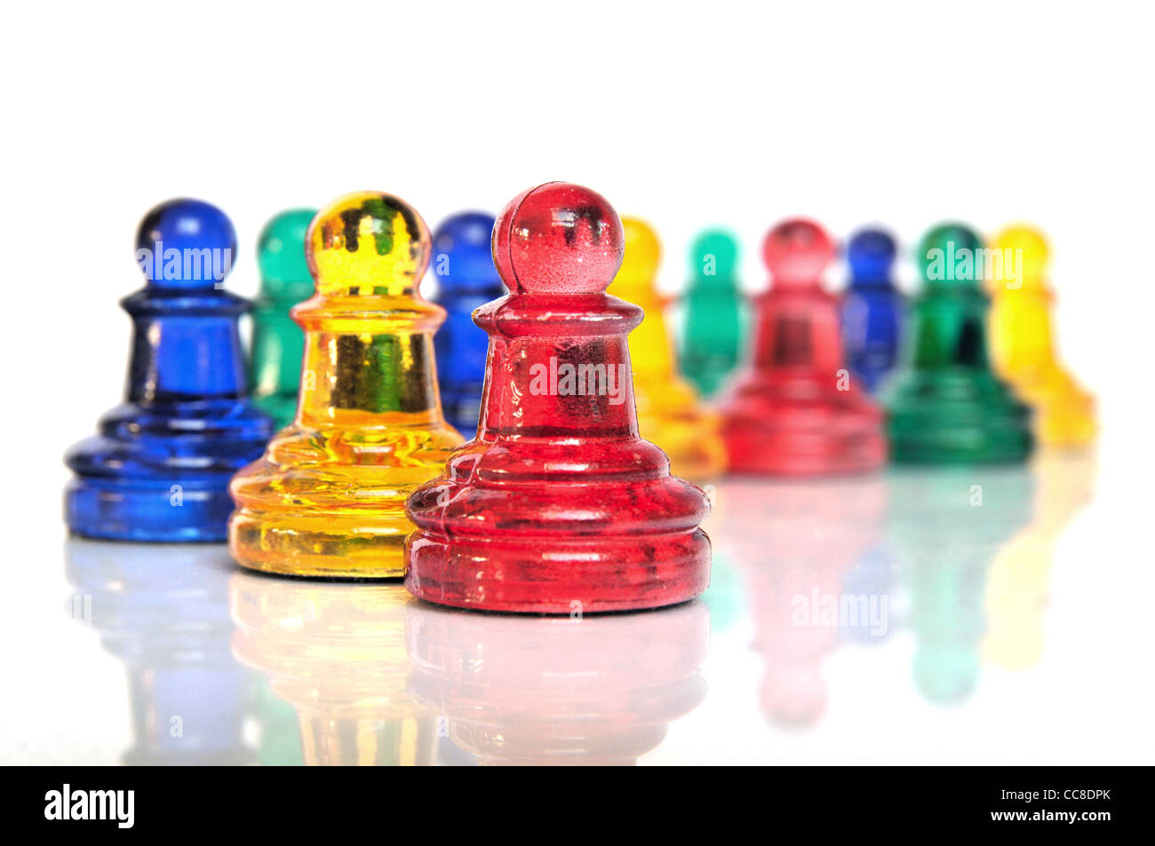 Multicolored ludo glass figures over white background Stock Photo - Alamy