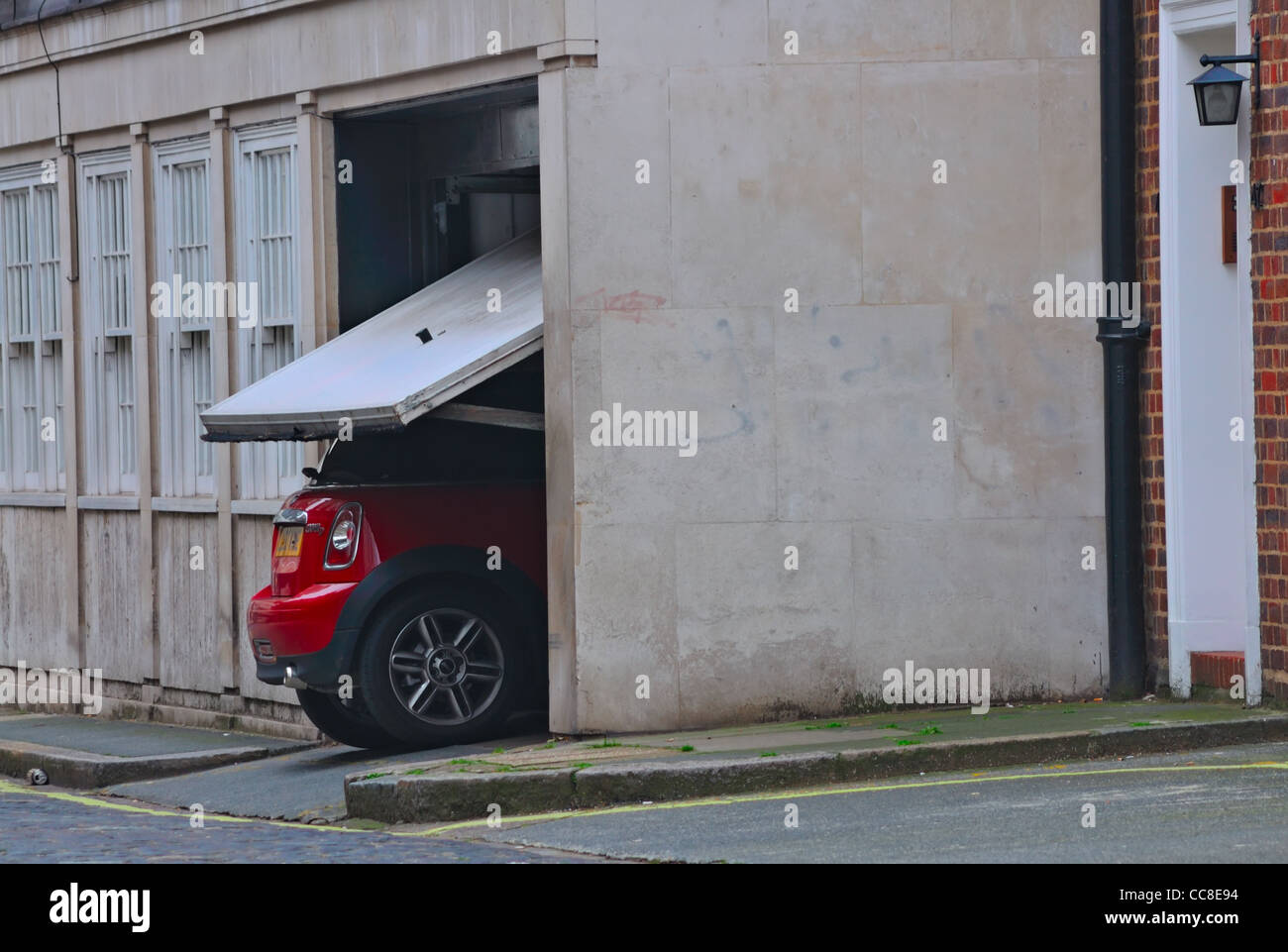 London: Mini Cooper parked in the garage for half Stock Photo - Alamy