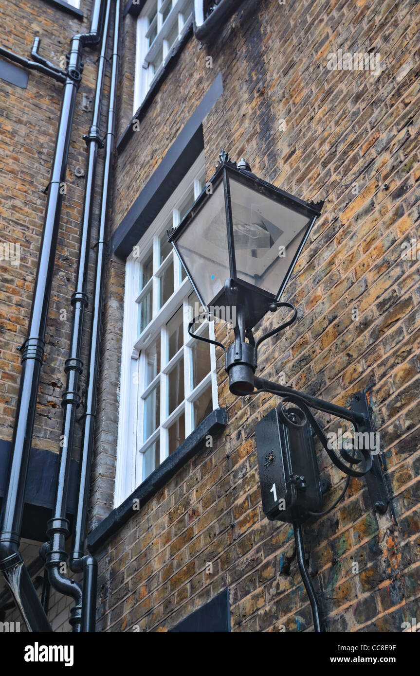 London: Brick wall, window, pipes and lantern Stock Photo - Alamy
