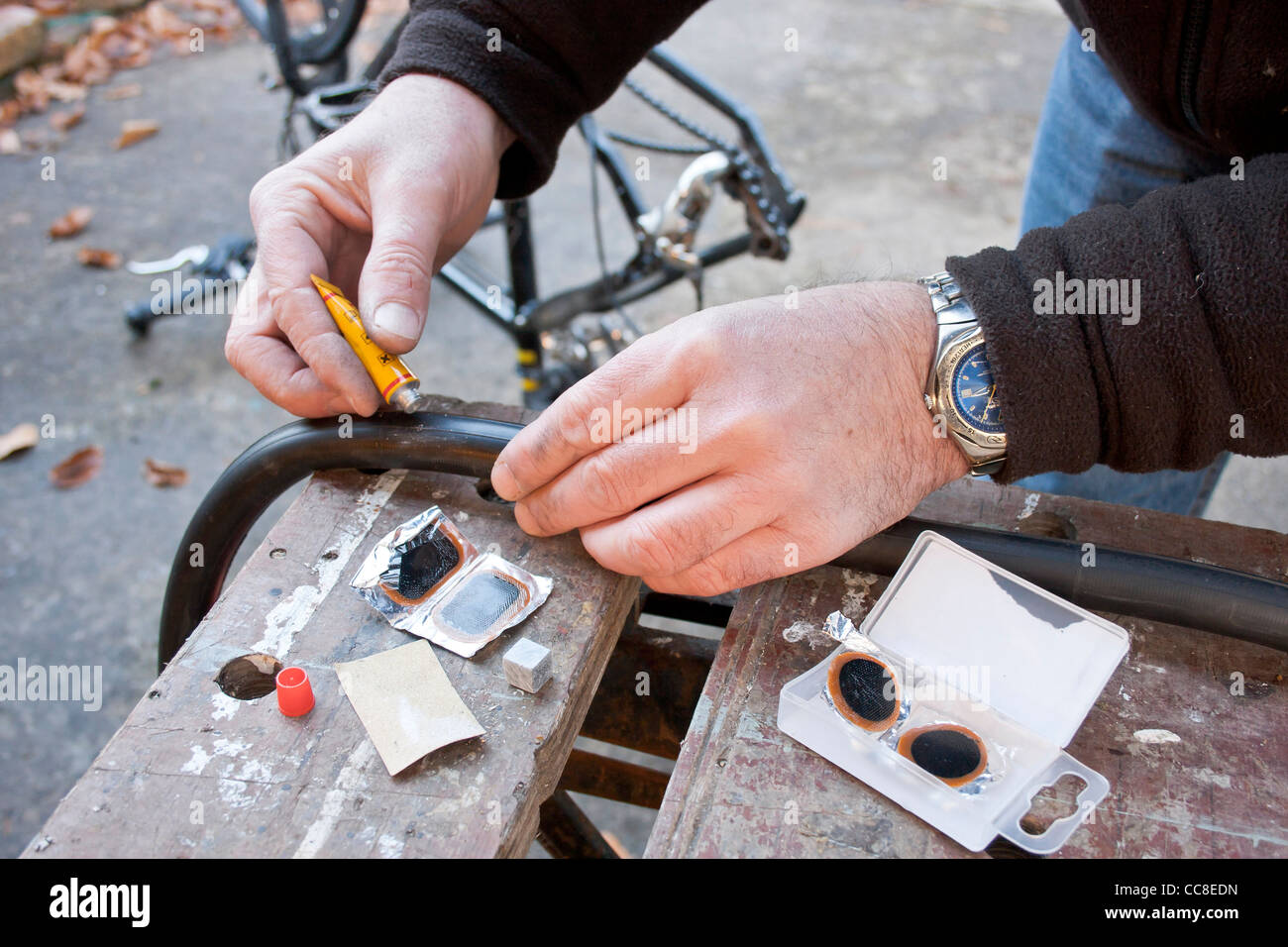Working Hands Repairing Bicycle Puncture Stock Photo - Alamy